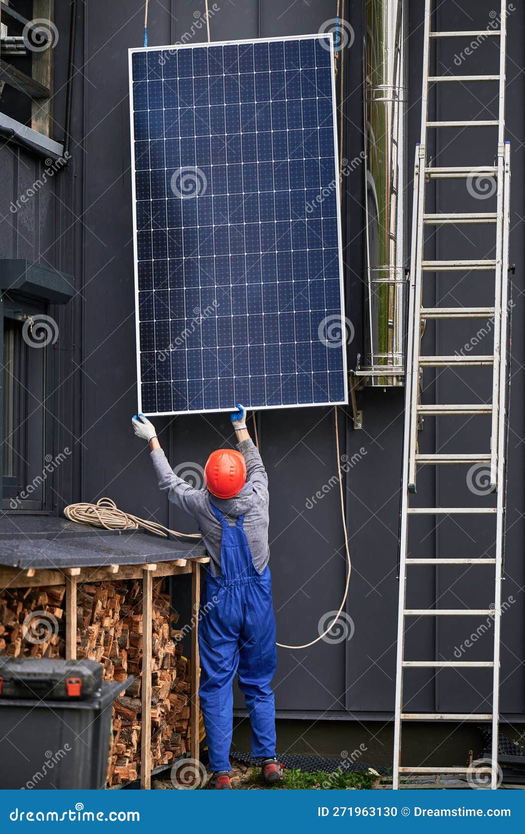 Workers Lifting Up Photovoltaic Solar Module while Installing Solar ...