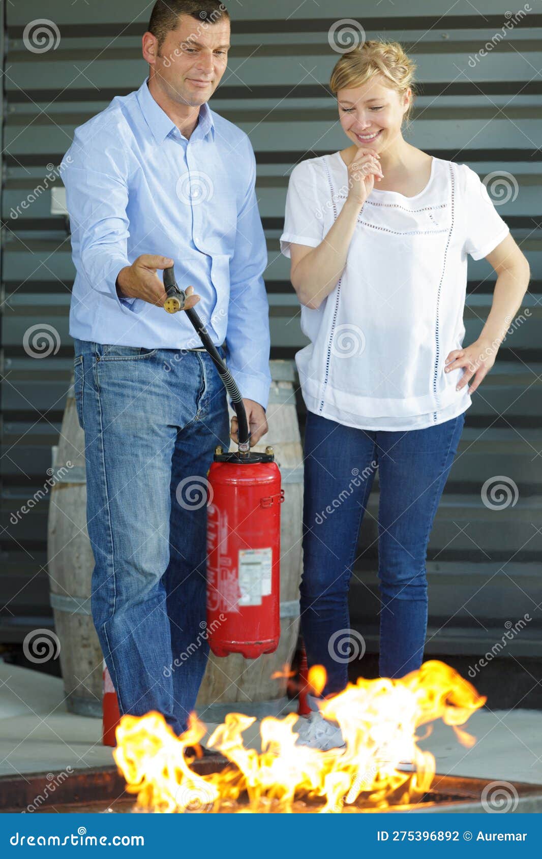 Men Training with Fire Extinguishers Stock Photo - Image of action ...