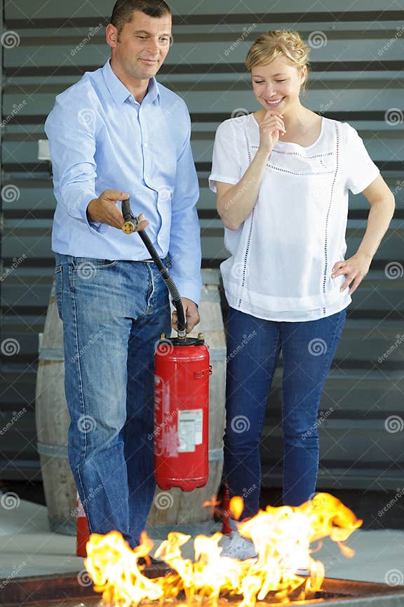 Men Training with Fire Extinguishers Stock Photo - Image of action, danger: 275396892
