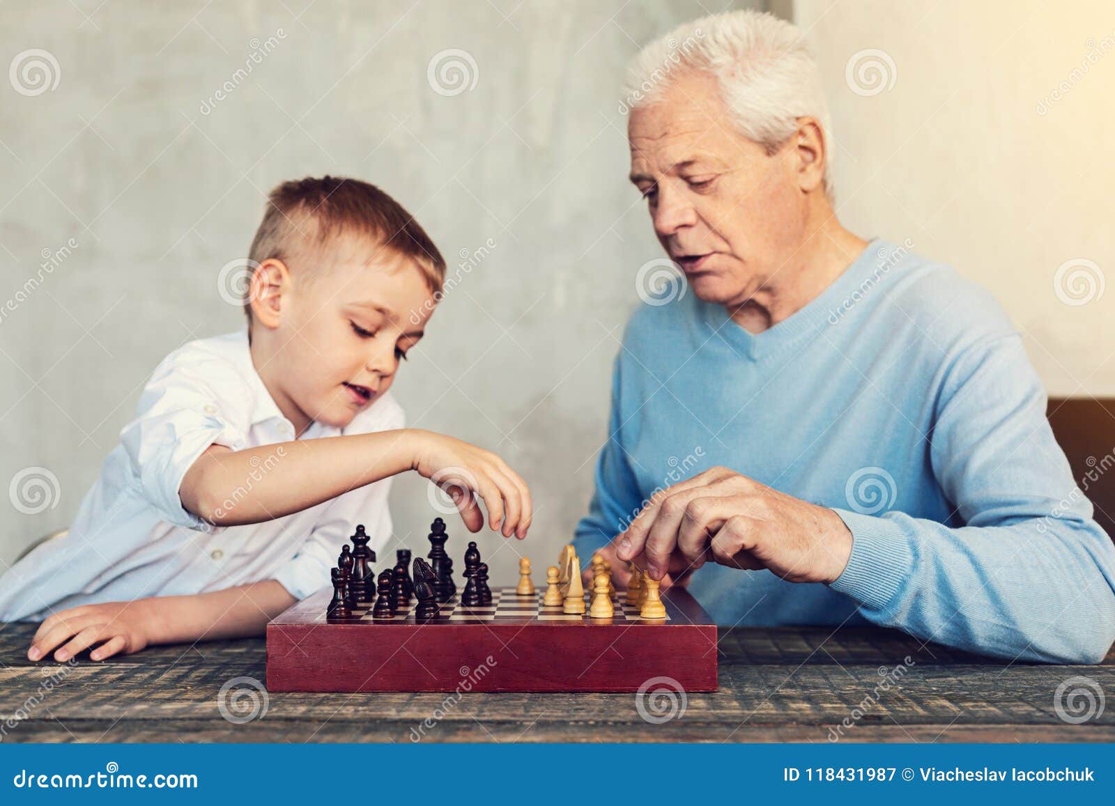 Men of Two Generations Playing Chess Together Stock Image - Image of ...