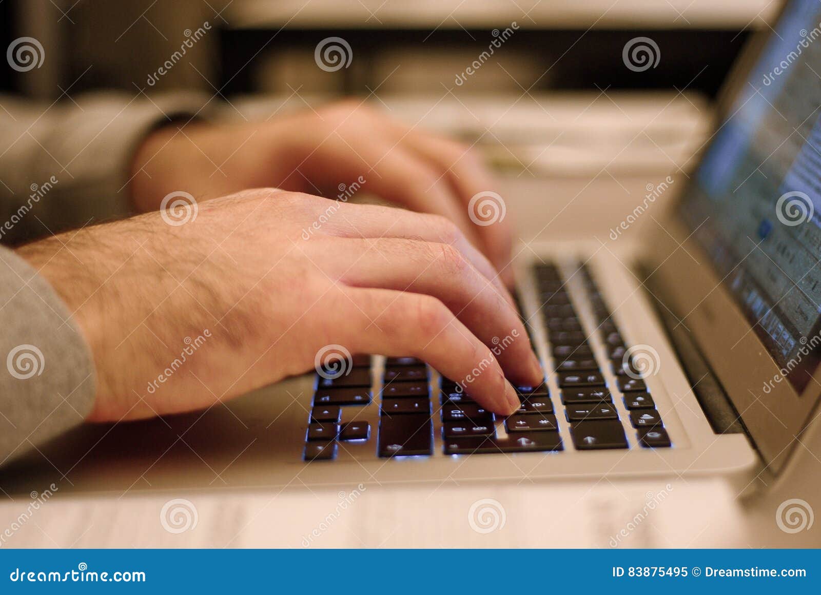 Men typing on his laptop stock image. Image of business - 83875495
