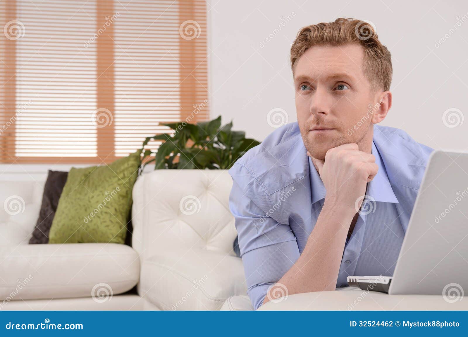 Men Using Computer at Home. Thoughtful Young Men Lying on Front Stock ...