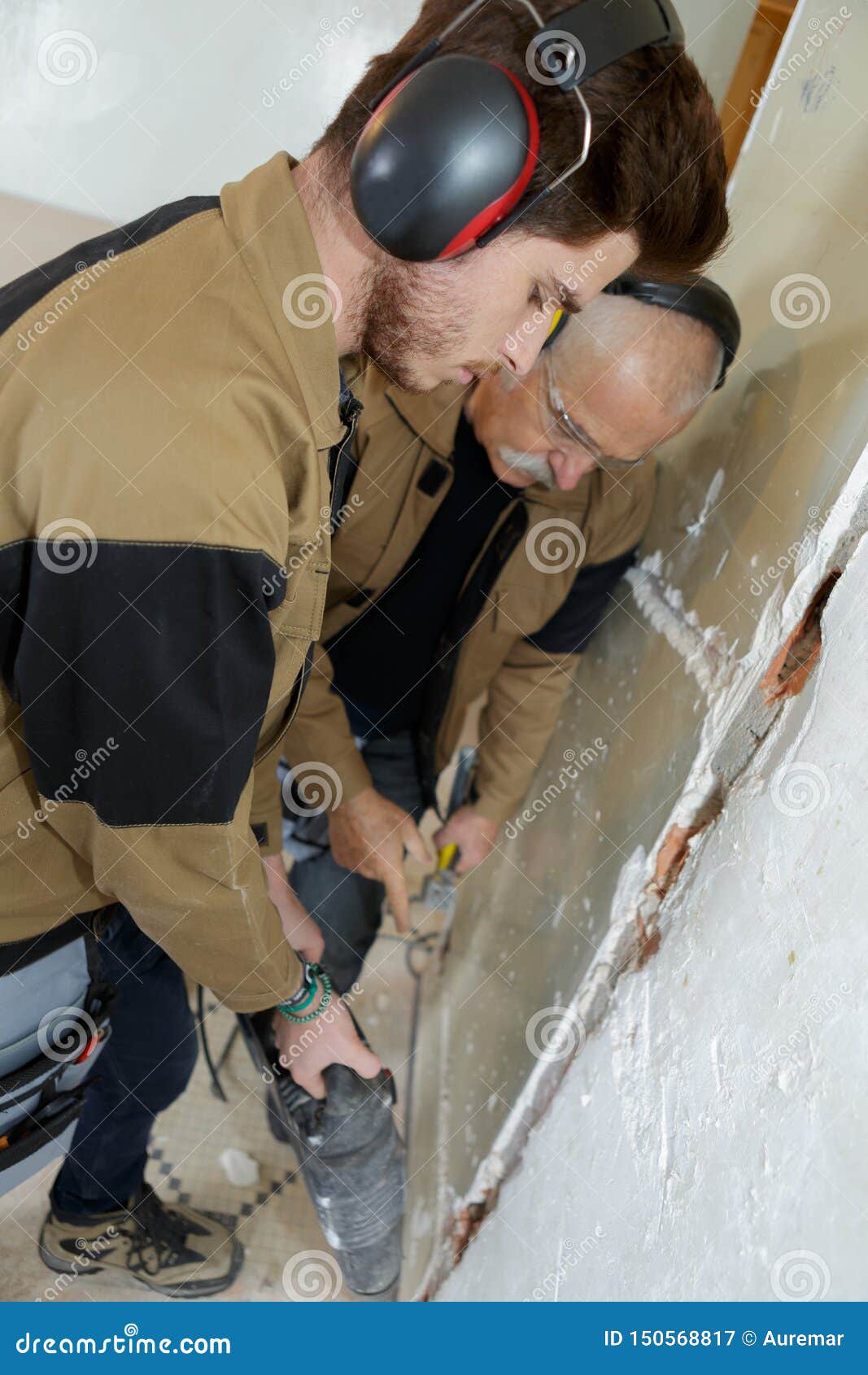 Men Using Hammer Drill To Remove Plaster from Wall Stock Image - Image ...