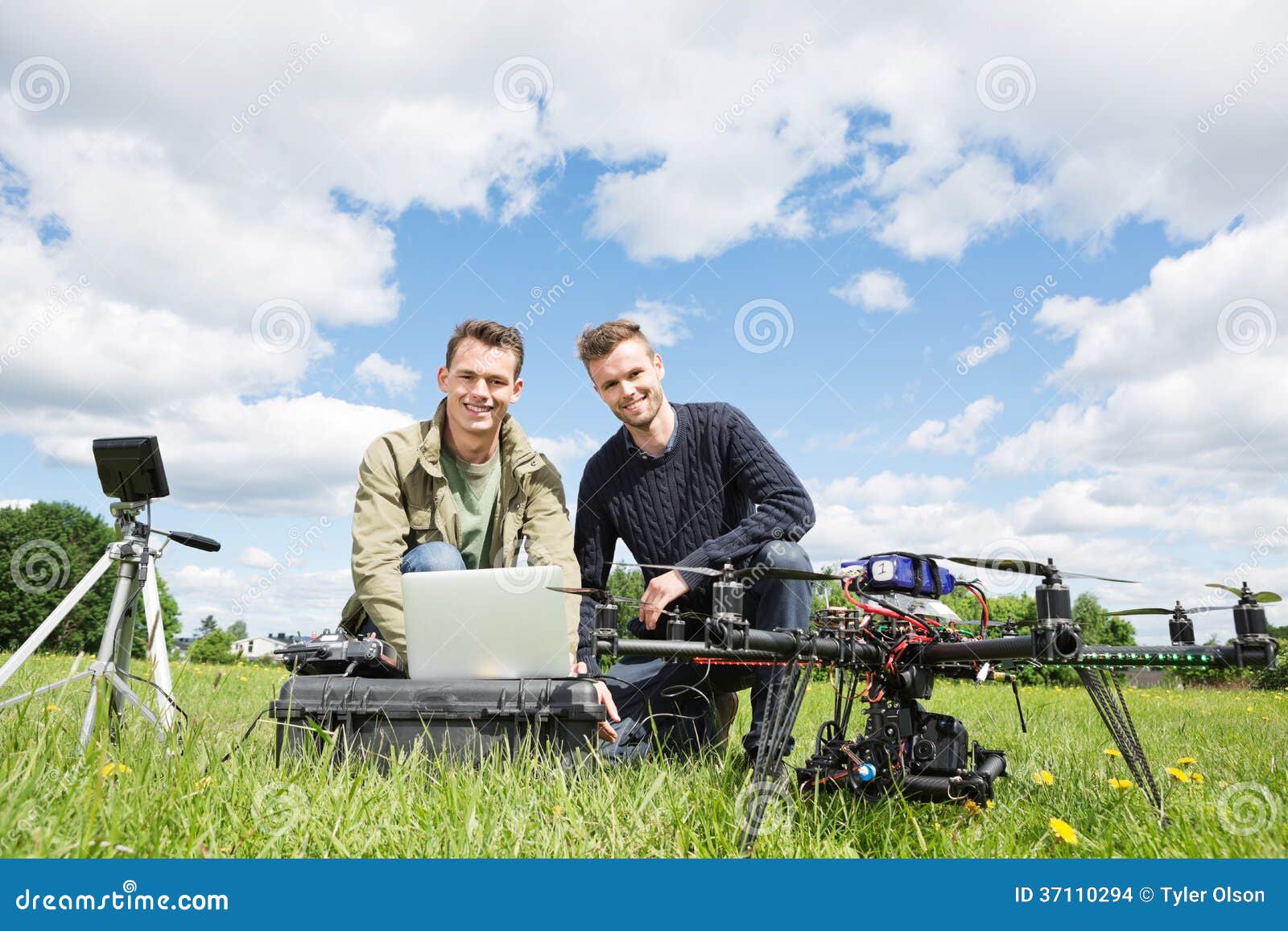 Men Using Laptop Next To UAV Stock Photo - Image of control, male: 37110294