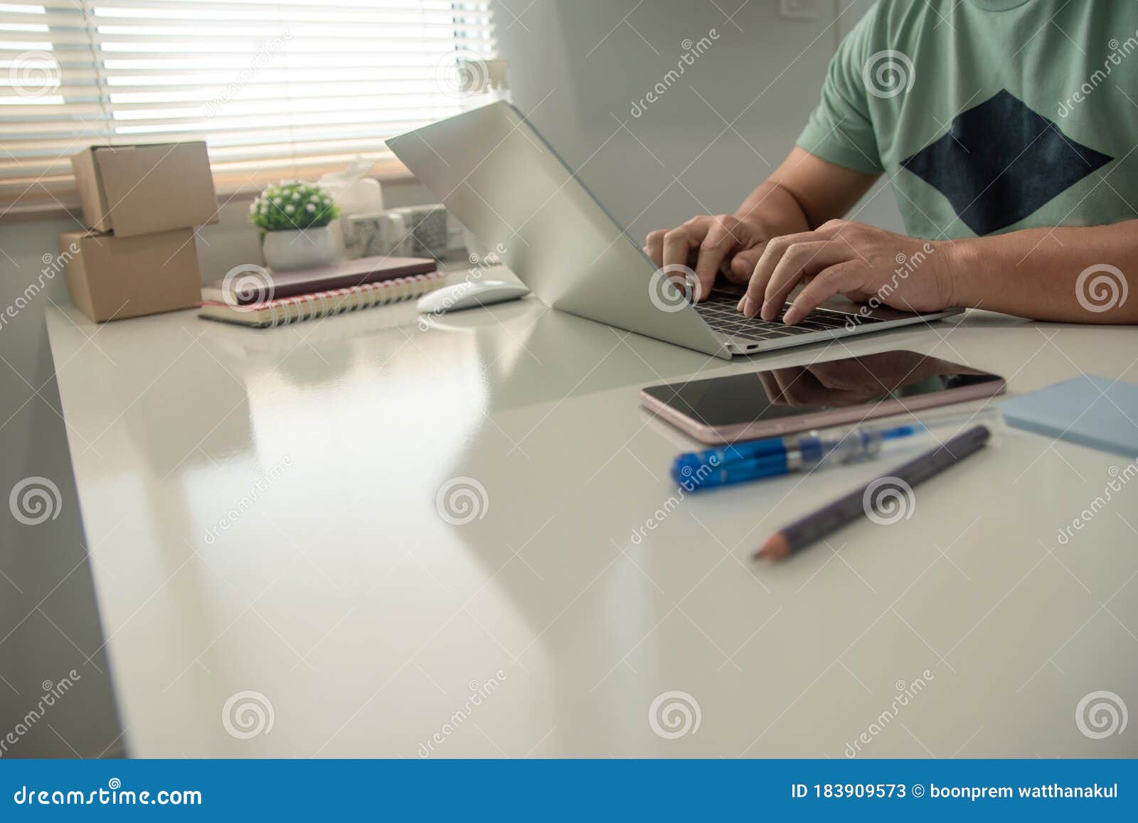 Men are Using Laptops on Their Dining Tables at Home. Stock Image ...