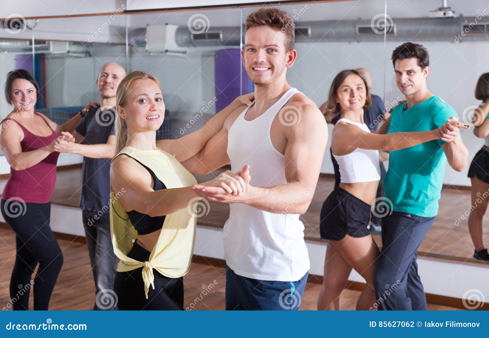 Men and Women Dancing Salsa O Bachata Stock Photo - Image of mirror ...