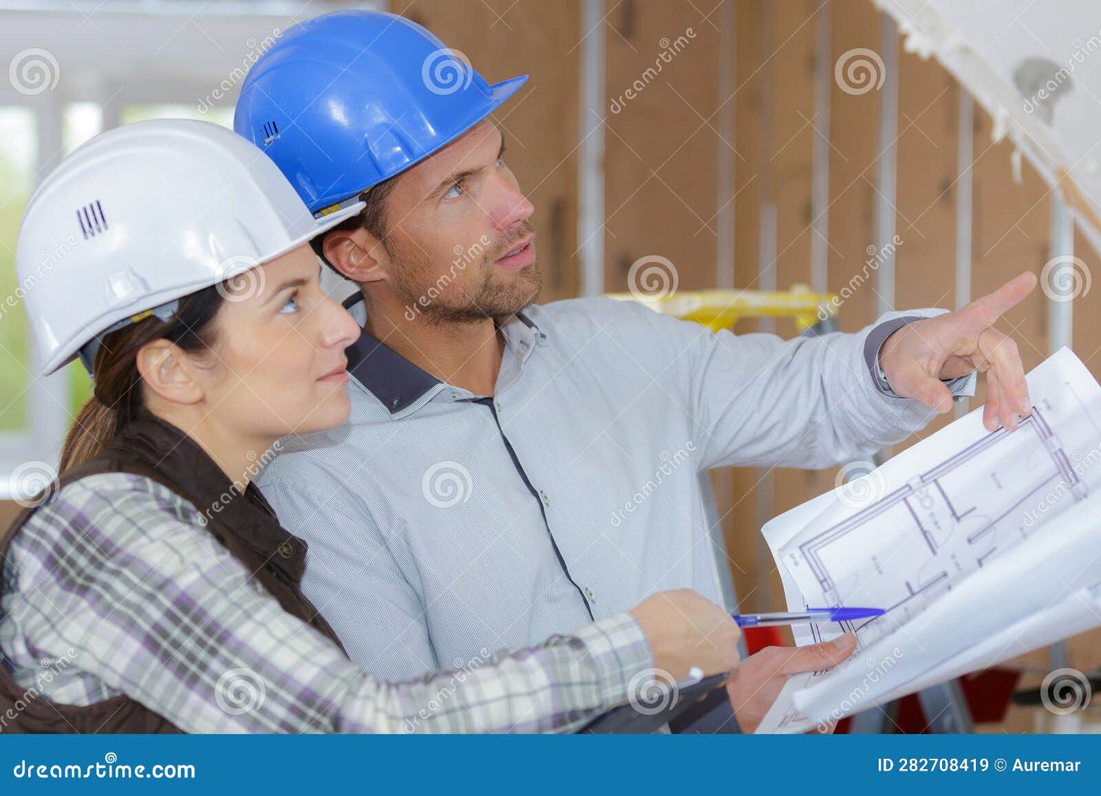 Men and Woman Engineers Checking Plan Stock Image - Image of renewable ...