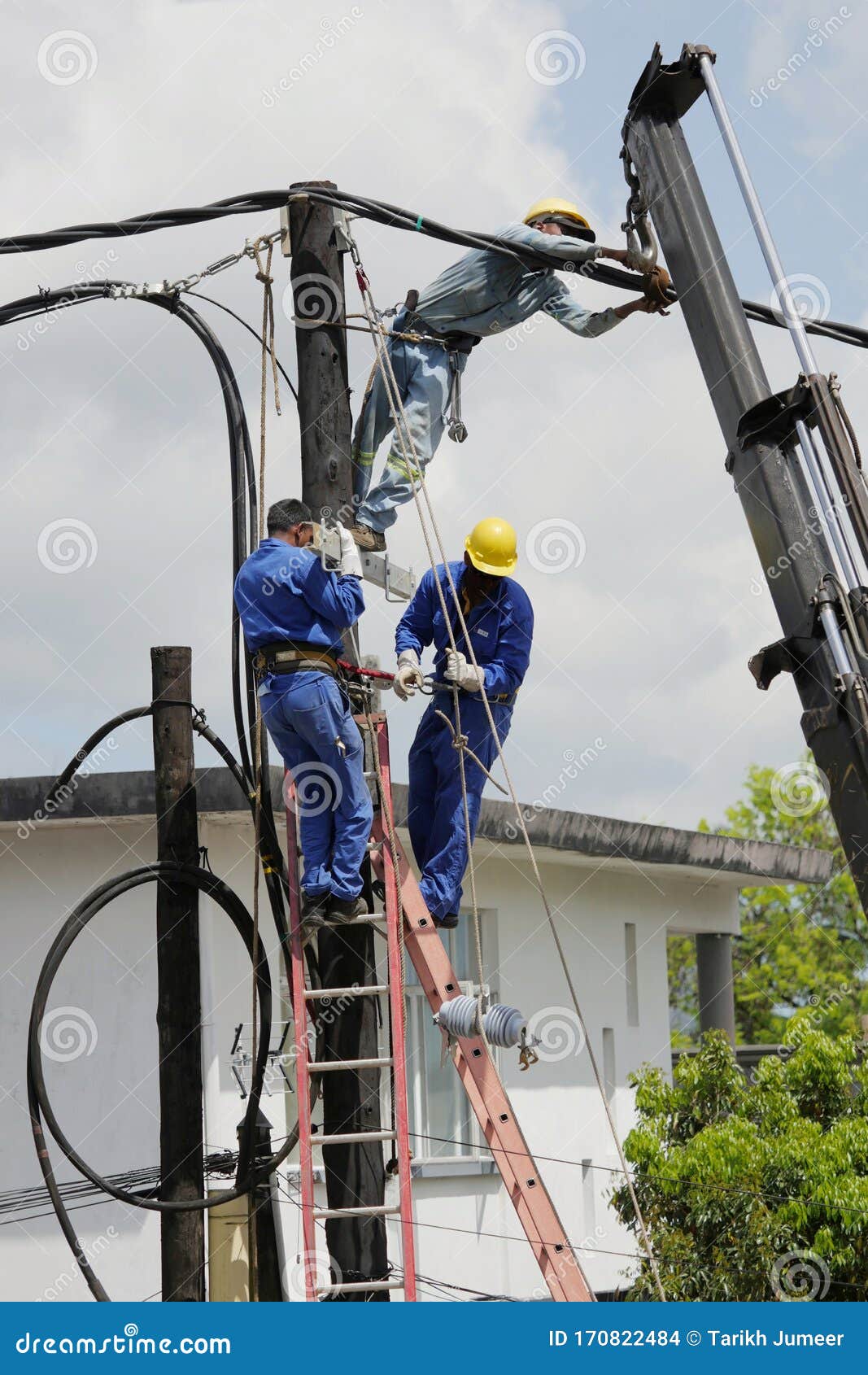 Men at Work on Electricity Column Editorial Stock Image - Image of blue ...