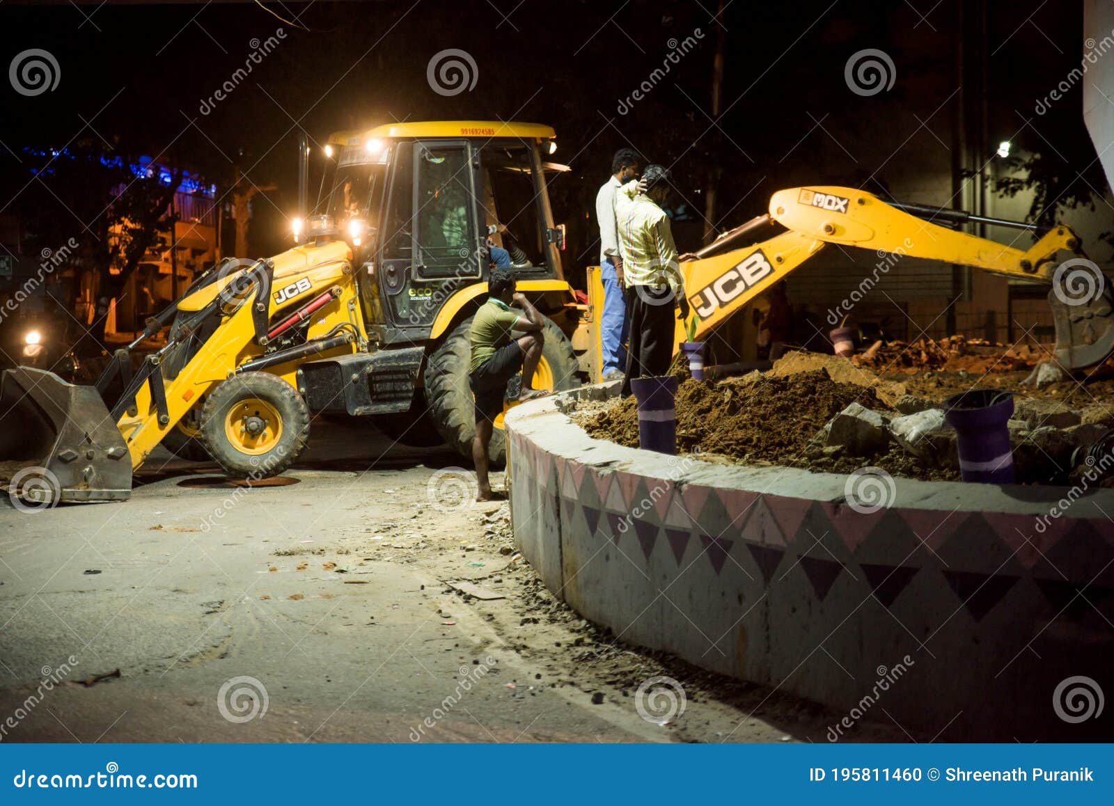 Men at work with JCB editorial image. Image of equipments - 195811460