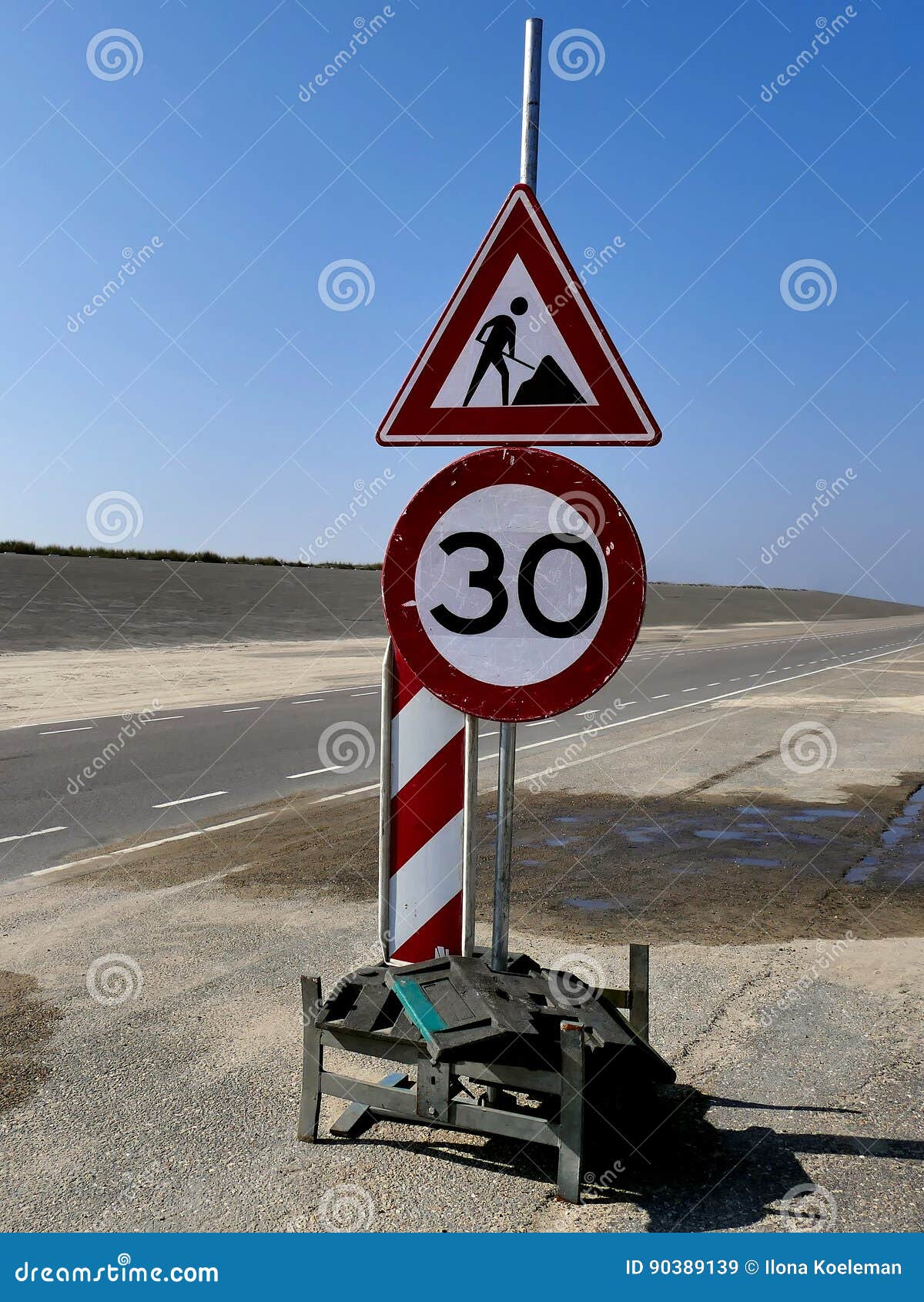 Men at Work Sign on Empty Road. Caution To Drive Slow. Stock Image ...