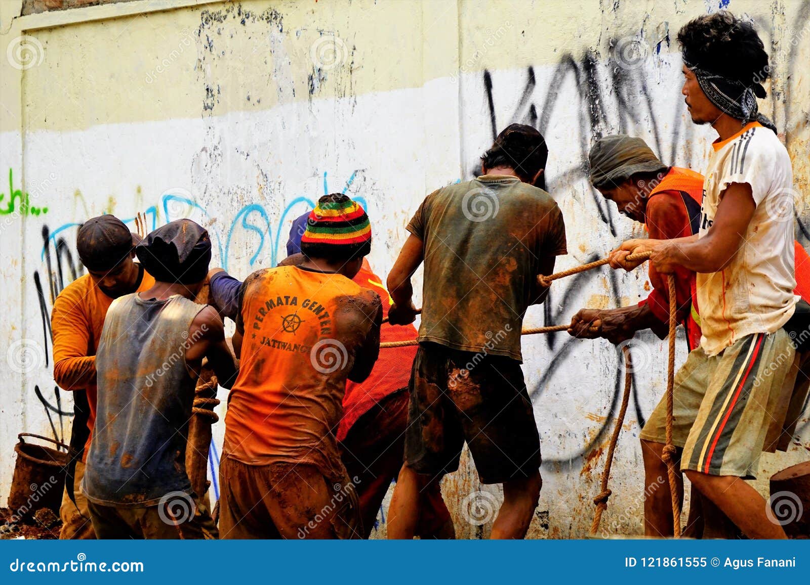 Men Work in a Team To Pull Underground Cable. Editorial Image - Image ...