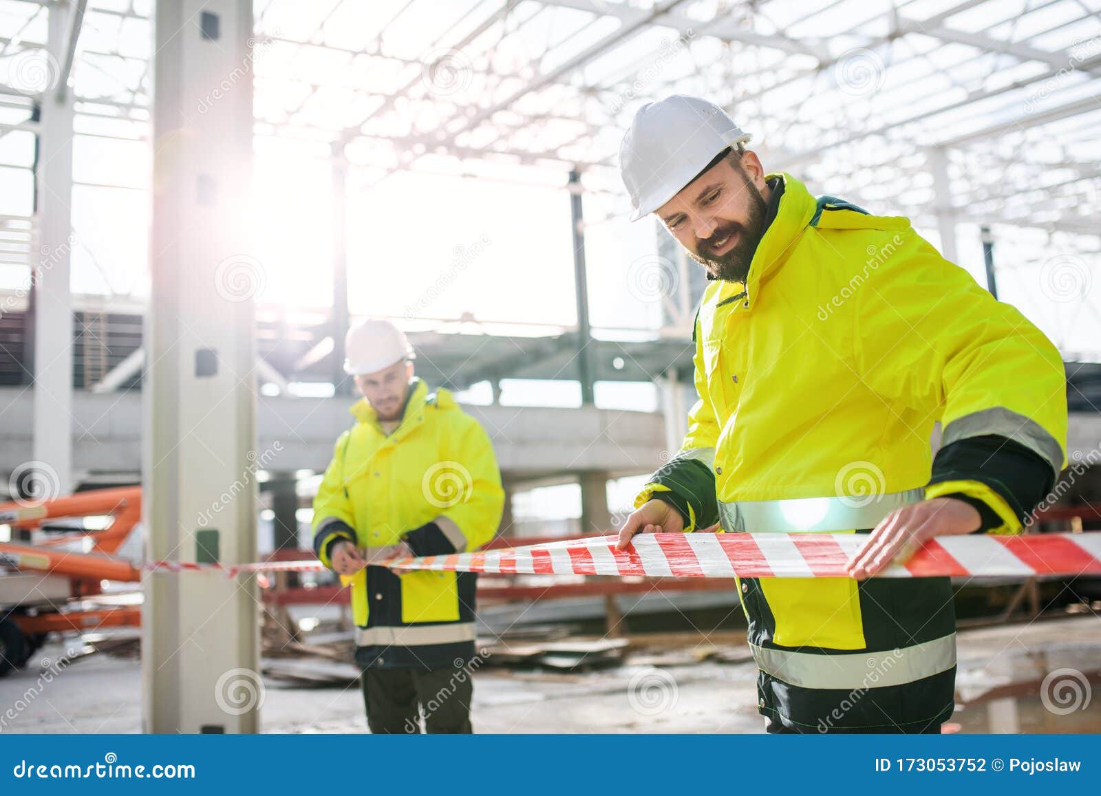 Men Workers Standing Outdoors on Construction Site, Working. Stock ...