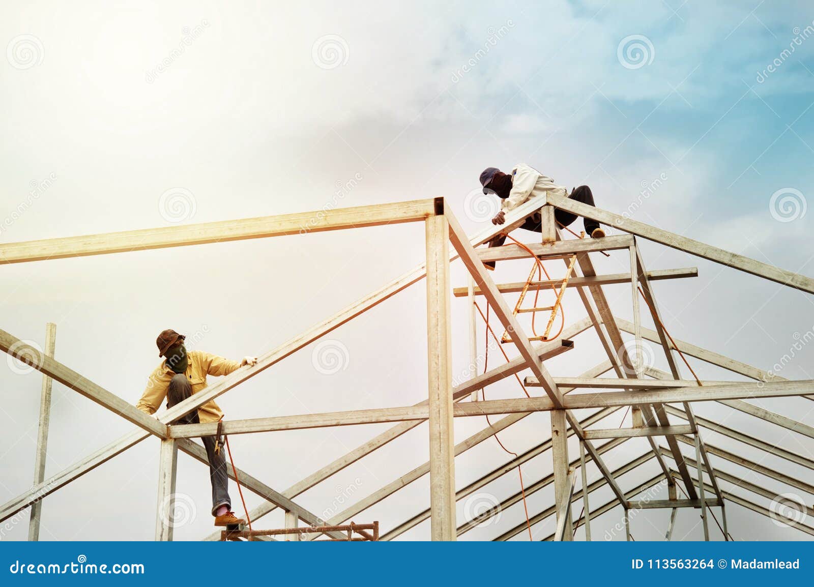 Men Workers on Steel Roof Construction Structure Industry with Stock ...