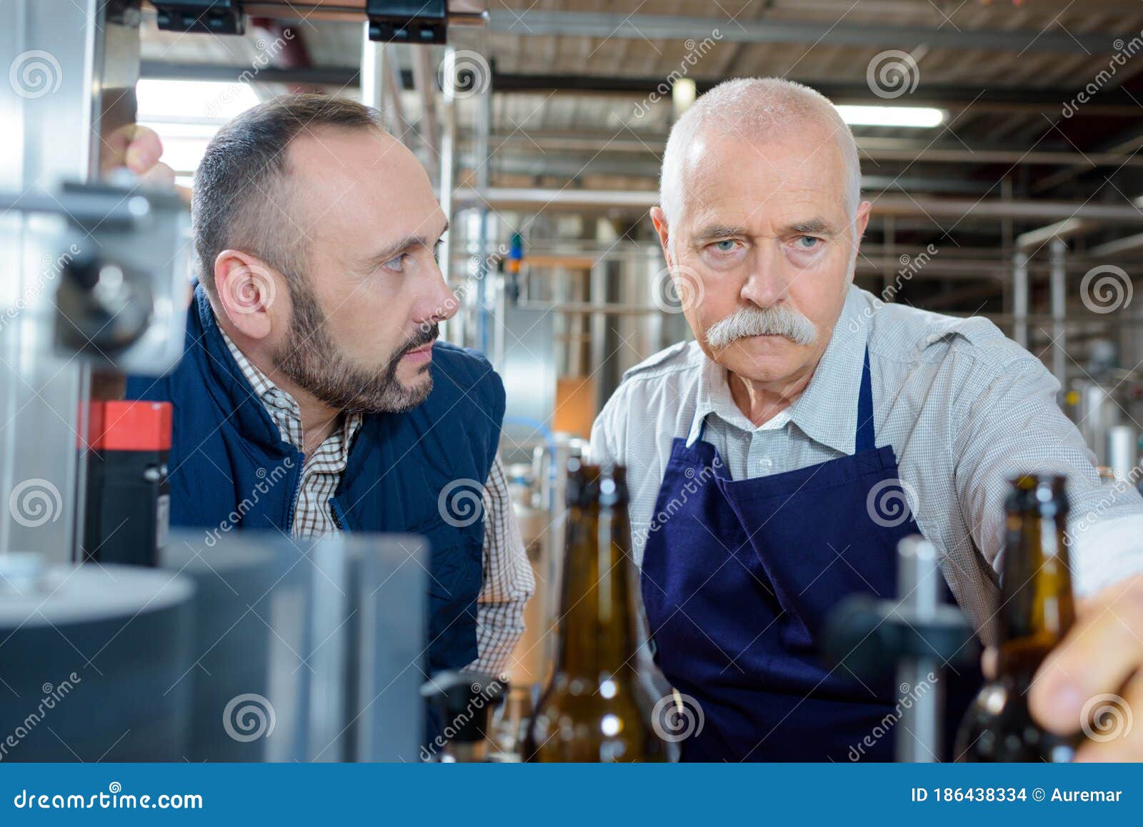 Men Working at Brewery or Beer Plant Stock Photo - Image of takingnotes ...