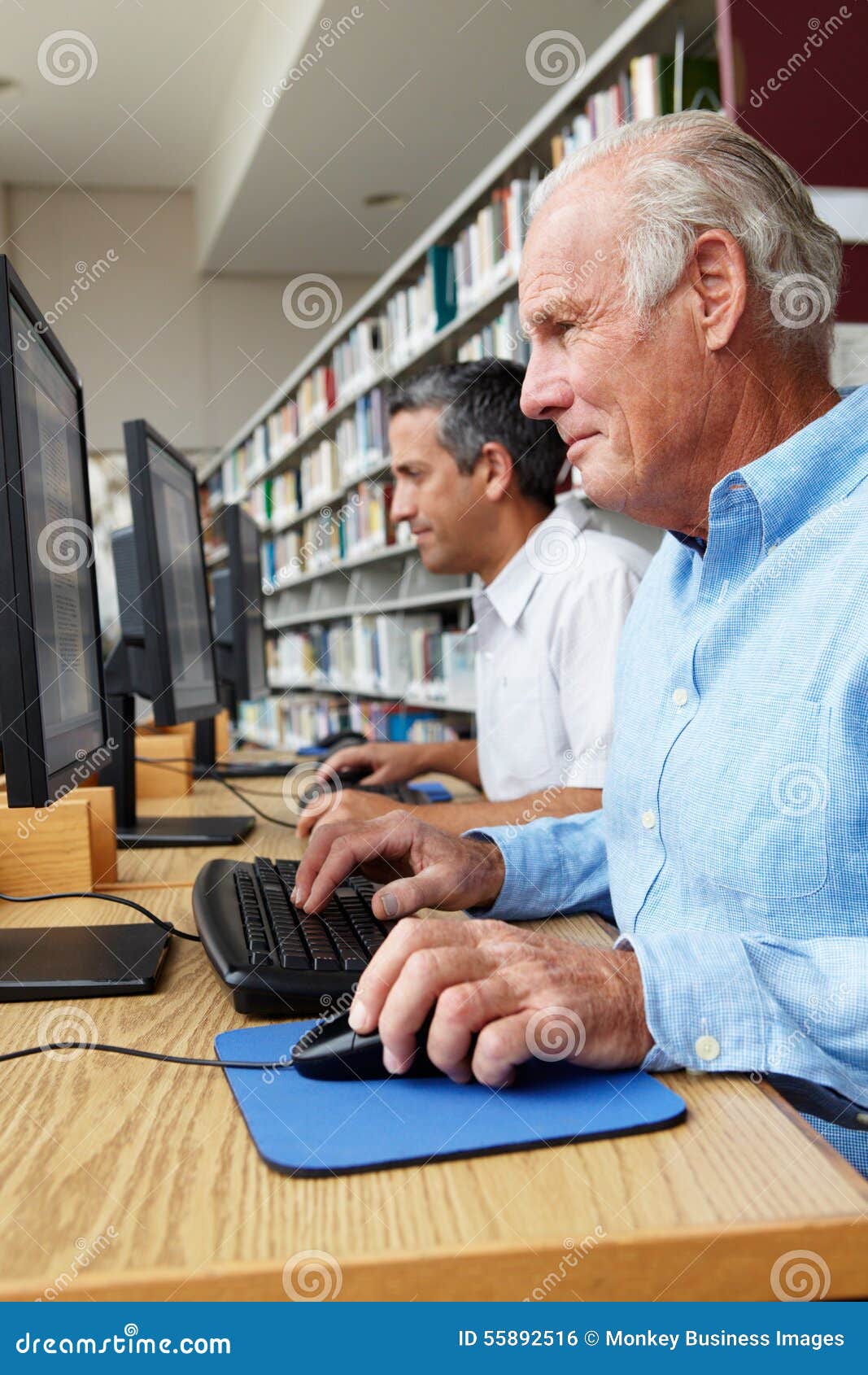 Men Working on Computers in Library Stock Photo - Image of information ...