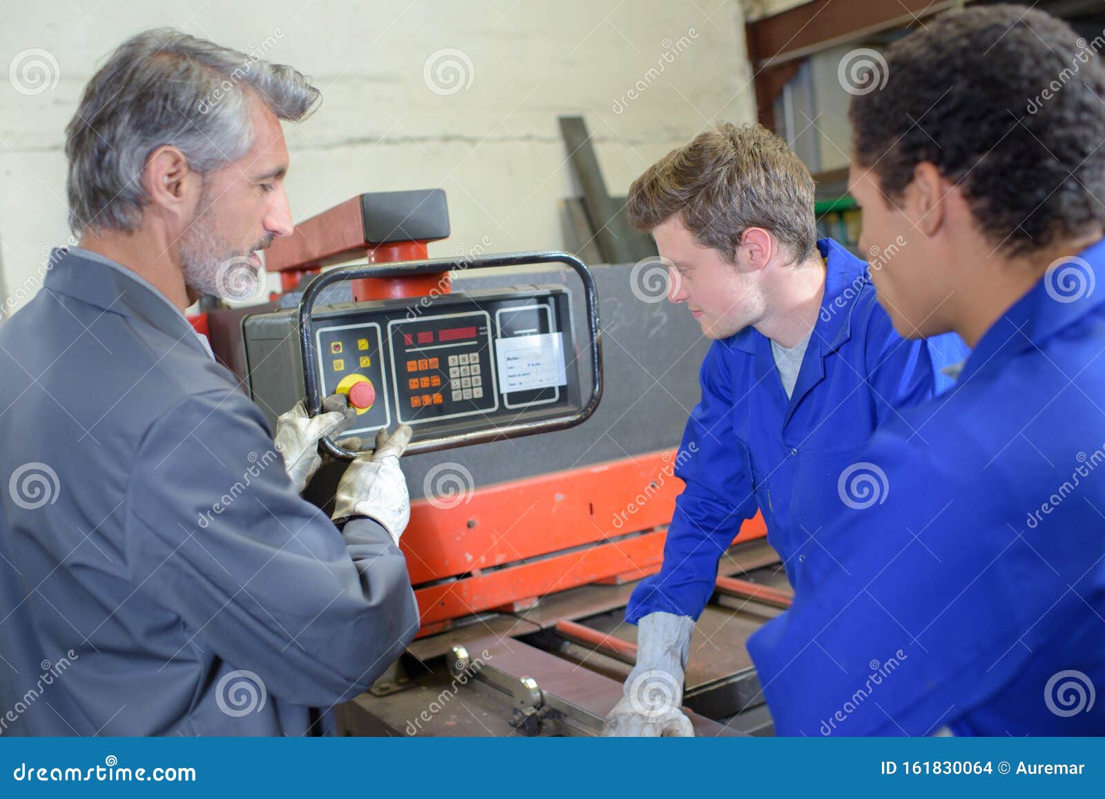 3 men working with machine stock photo. Image of teen - 161830064