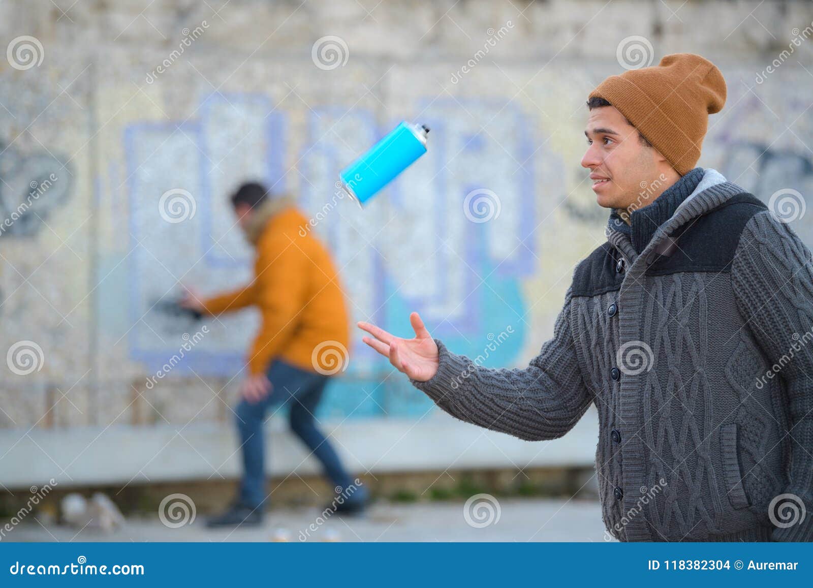 Men Writing Graffiti and Playing with Spray Can Stock Photo - Image of ...
