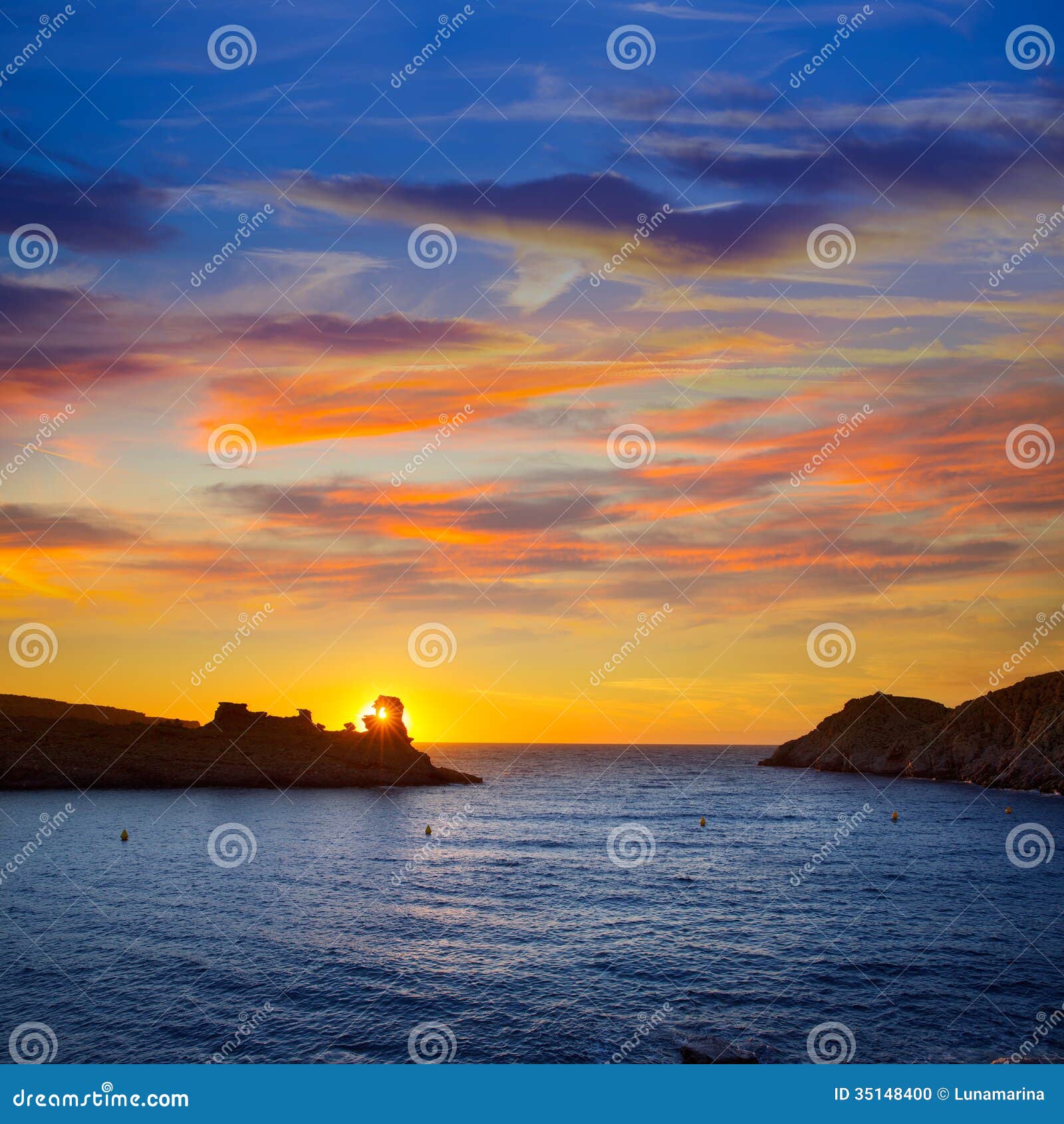 Menorca Sunset in Cala Morell at Ses Torretes Beach Stock Photo - Image ...