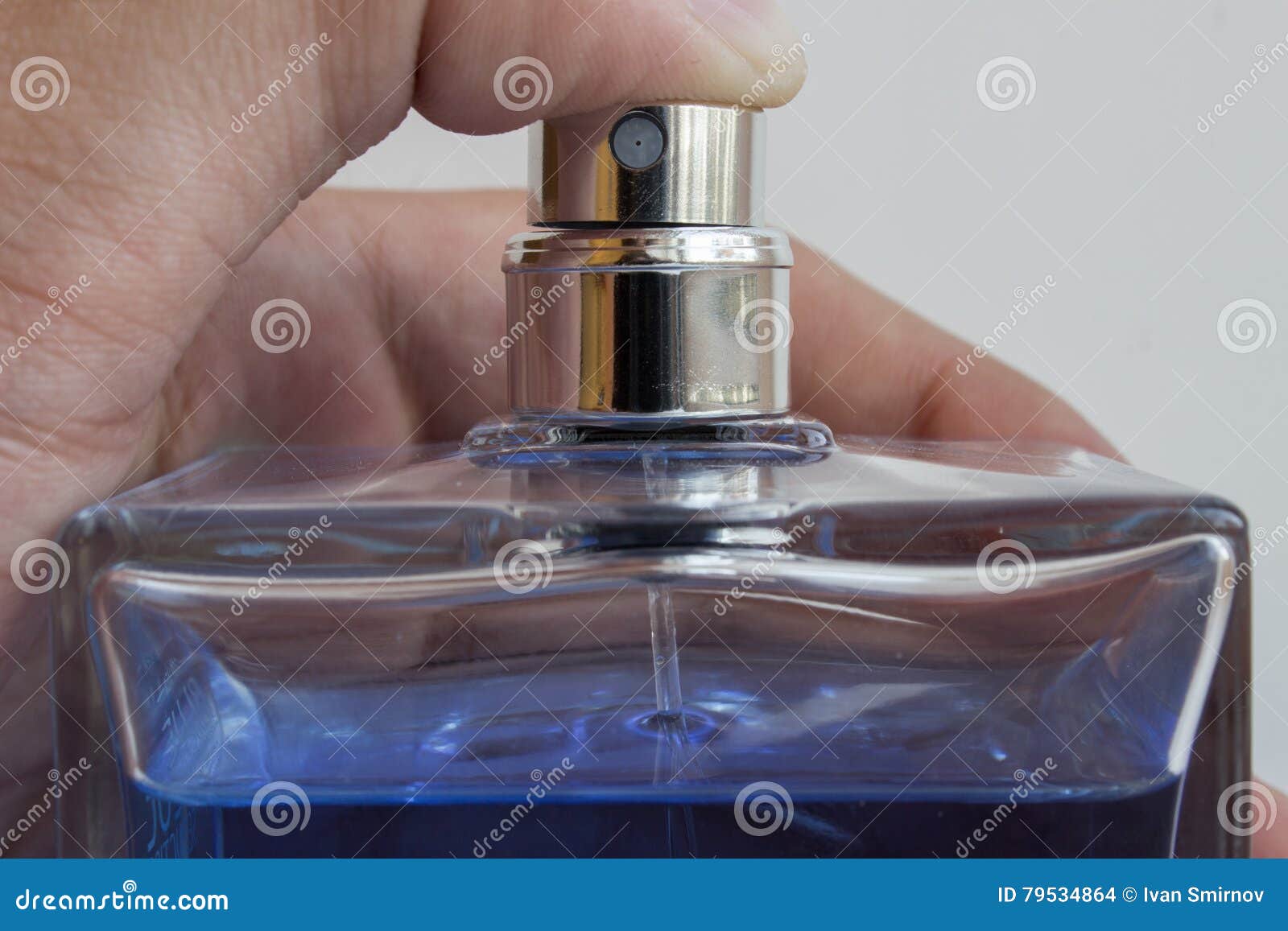 Mens fragrance in his hand stock photo. Image of container - 79534864