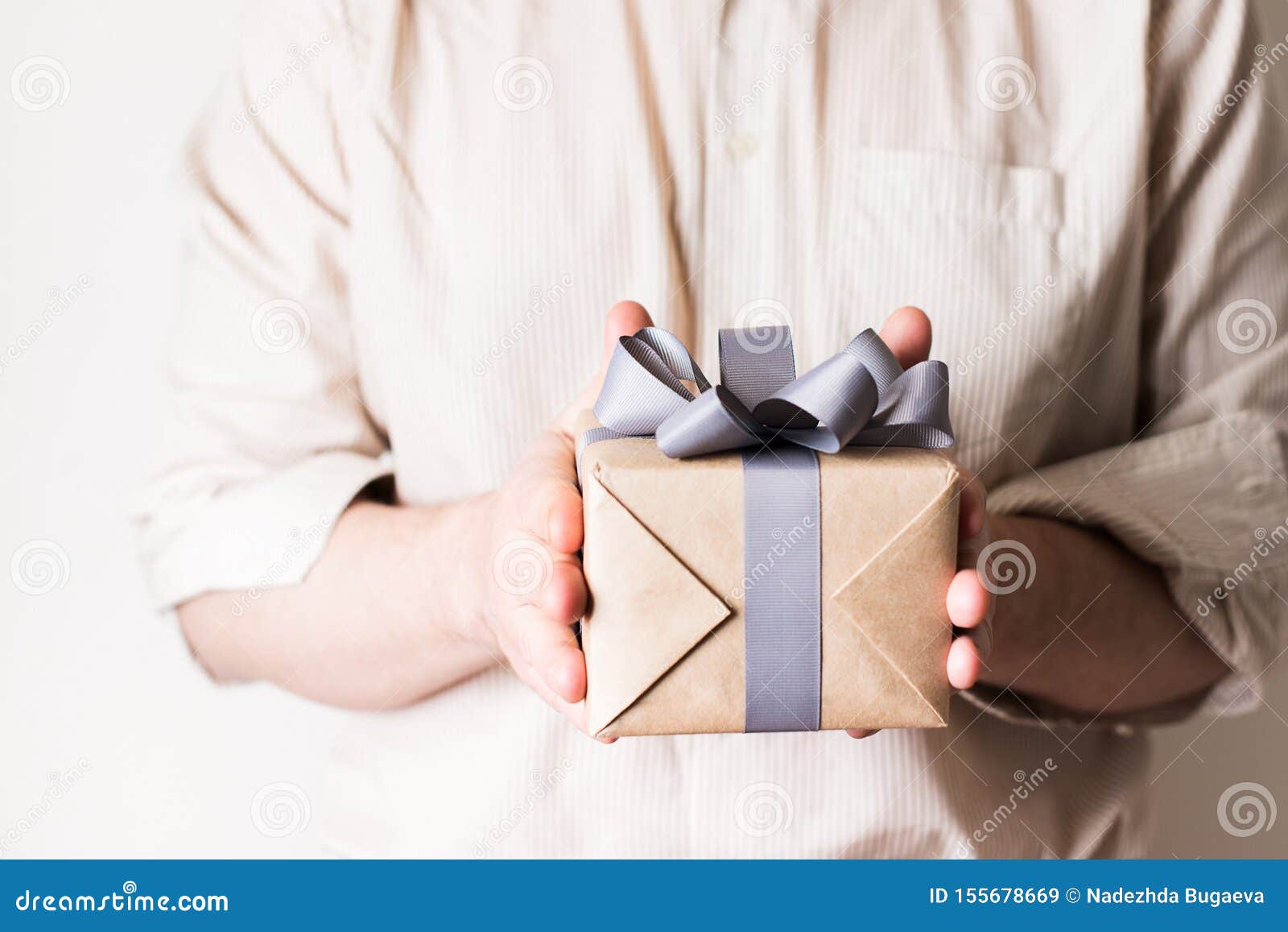 Mens Hands Giving a Gift Box with Gray Bow, White Background Card Stock ...
