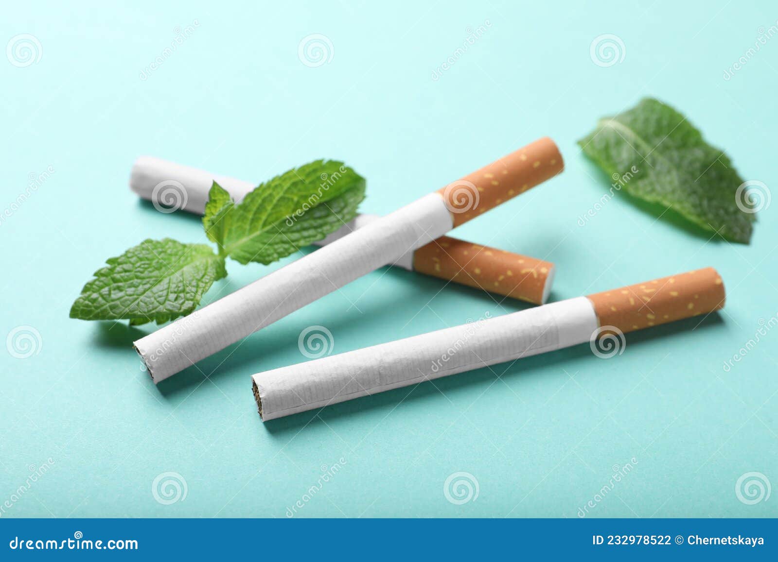 Menthol Cigarettes and Mint on Turquoise Background Stock Photo - Image ...