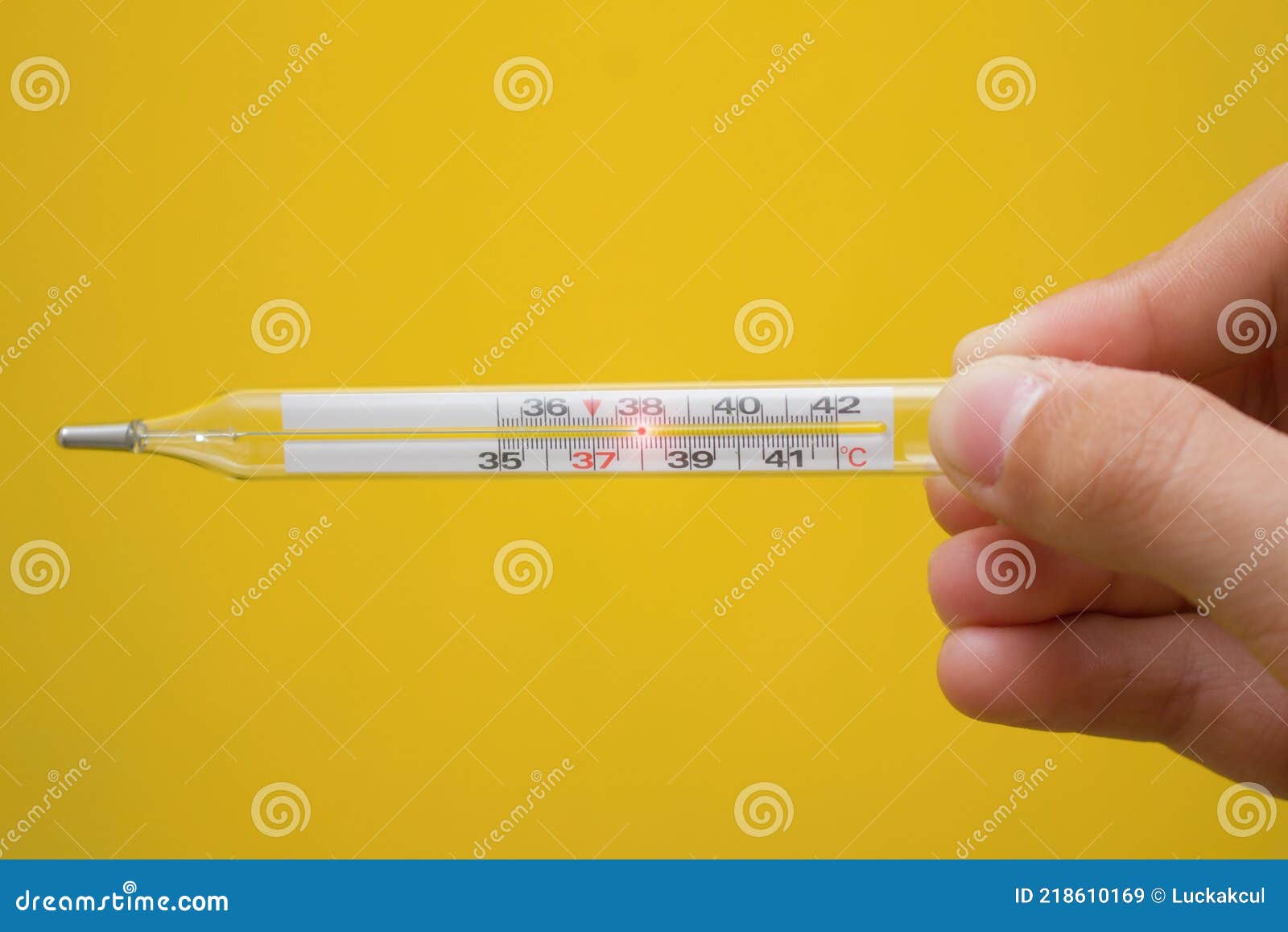 The Mercury Thermometer Shows 38 ° C Thermometer In Hand In Front Of