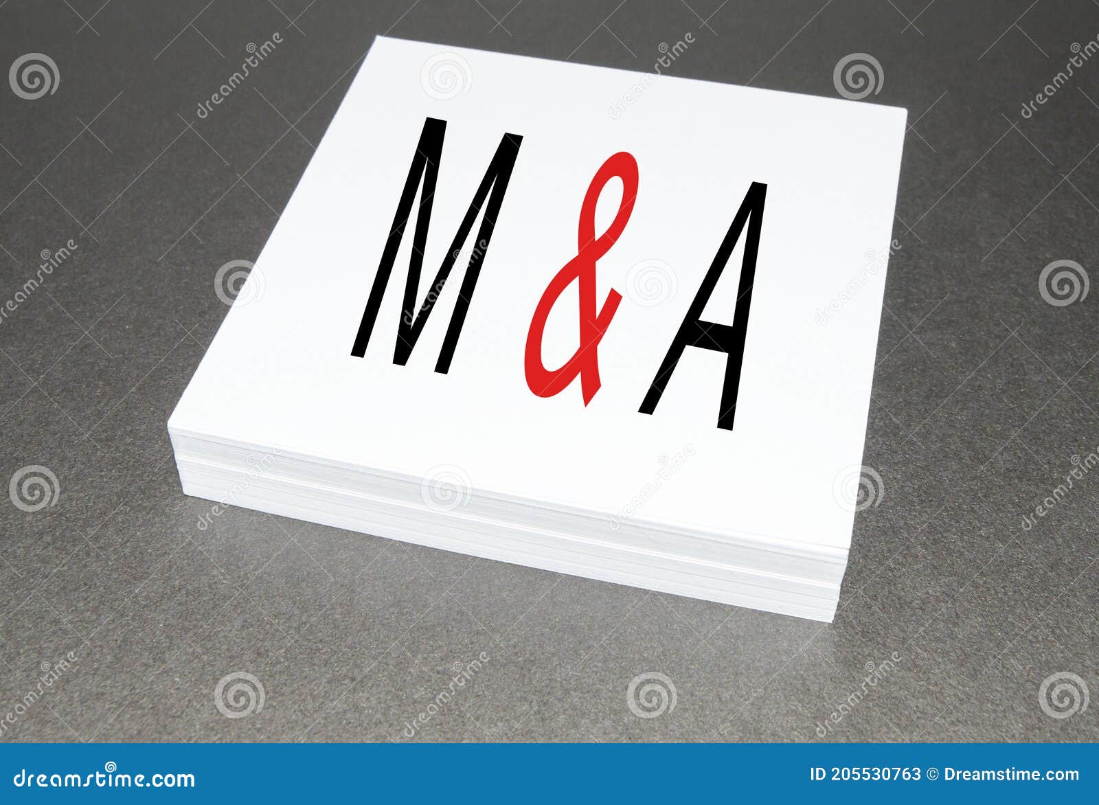 Mergers and Acquisitions Text on a WHITE PAPER BLOCK on a Black ... Mergers and Acquisitions Text on a WHITE PAPER BLOCK on a Black ...