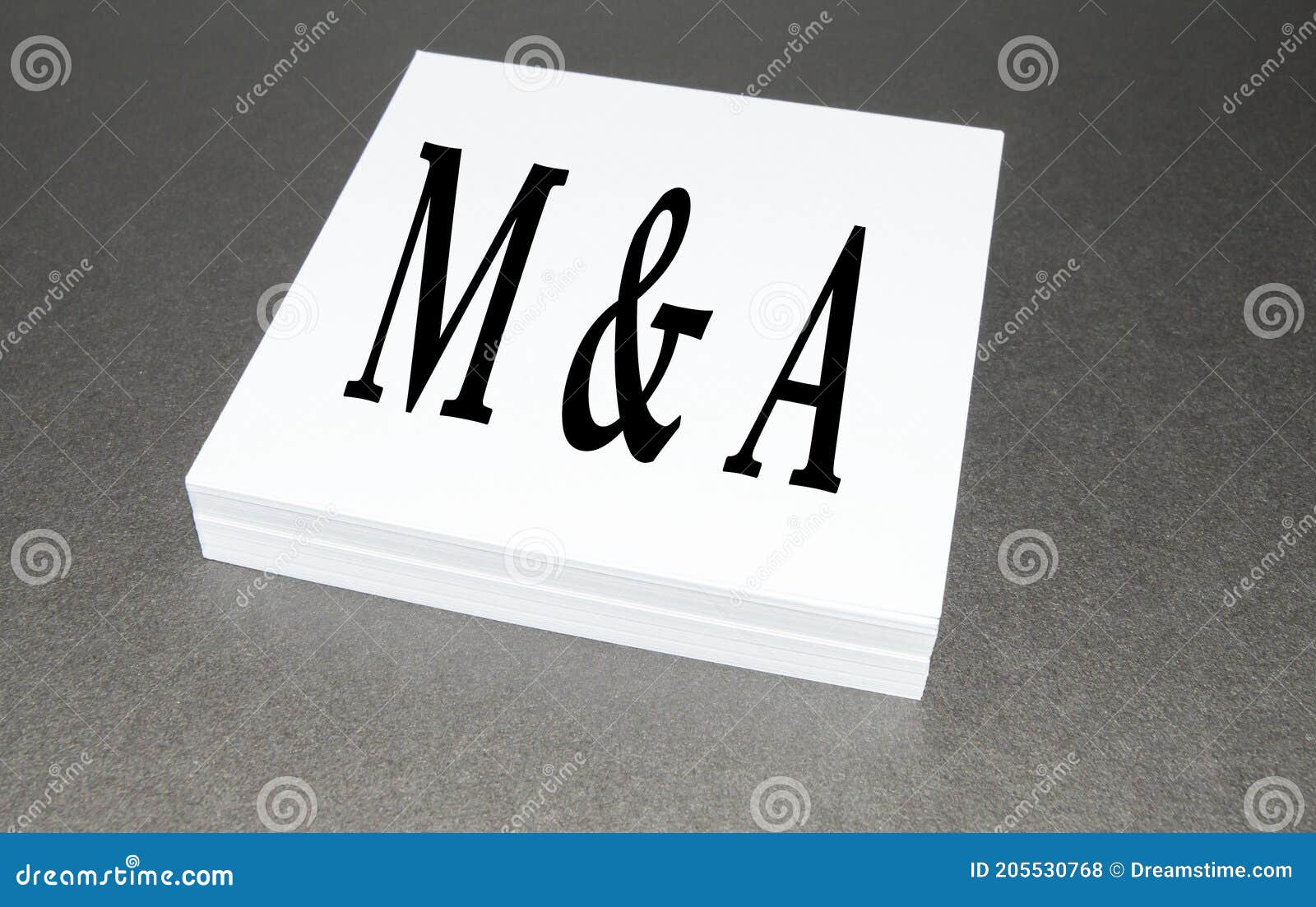 Mergers And Acquisitions Text ON A WHITE PAPER BLOCK ON A Black ... Mergers And Acquisitions Text ON A WHITE PAPER BLOCK ON A Black ...
