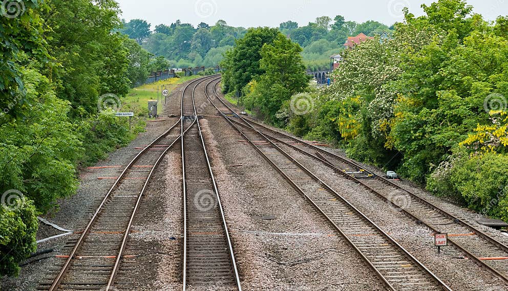 Merging railway tracks stock photo. Image of green, symbol - 72322316