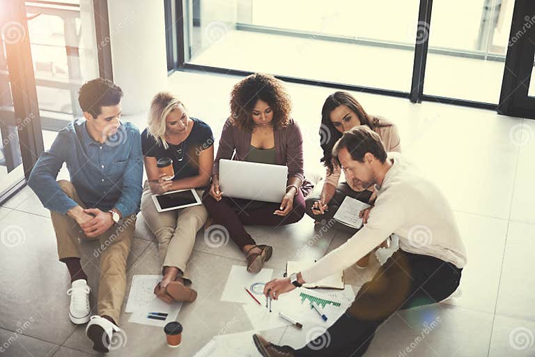 Merging Their Creative Input. a Team of Designers Brainstorming on the ...