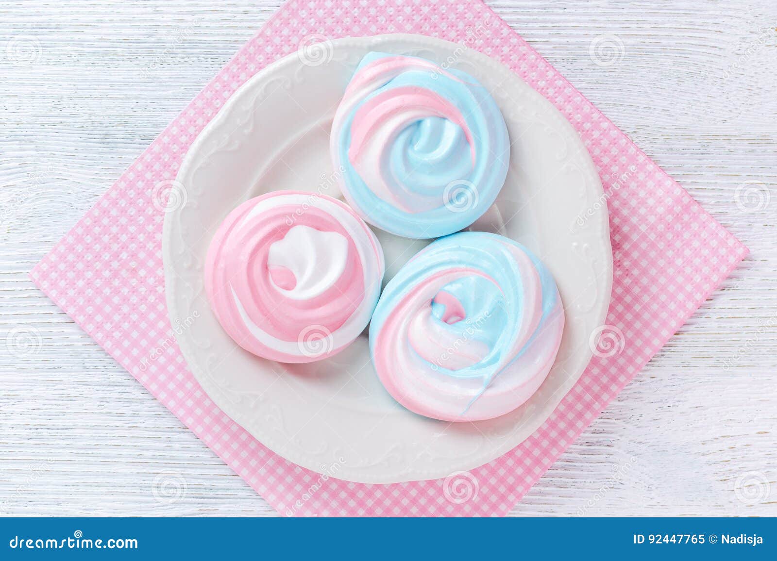 Meringues in Pastel Colors with Abstract Pattern on a Plate and a Pink ...