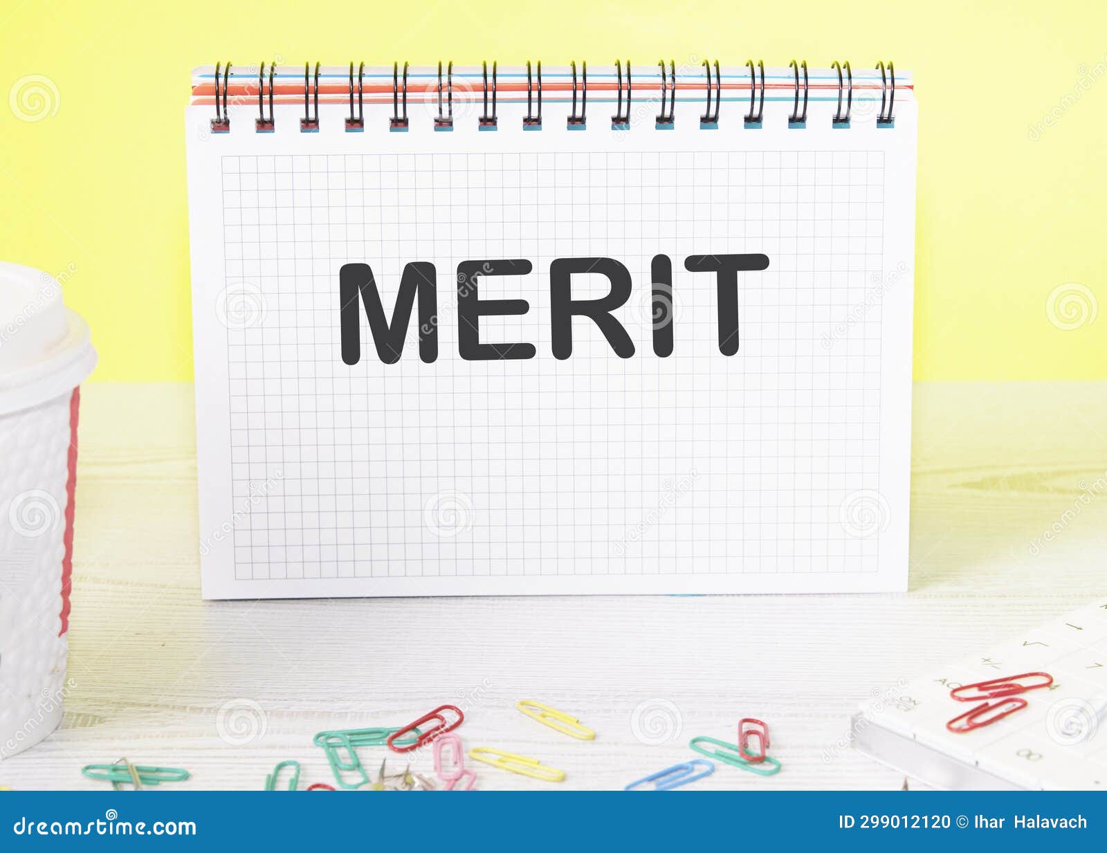 Merit the Word is Written on a Blank Sheet in a Notebook Standing on a ...