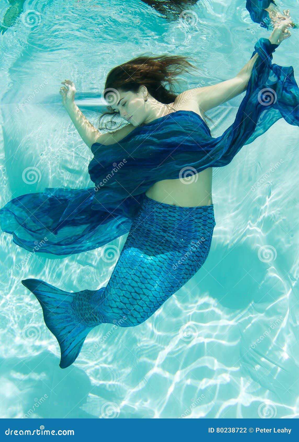 Mermaid in Blue Water Wearing Blue Stock Photo - Image of shell, woman ...