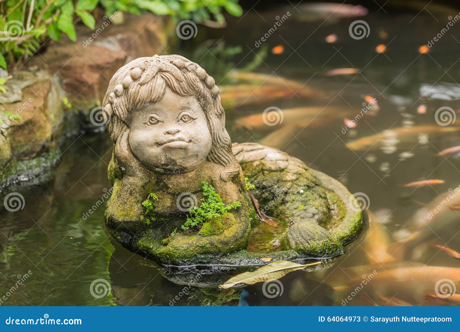 Mermaid statue in the pond stock image. Image of statue - 64064973