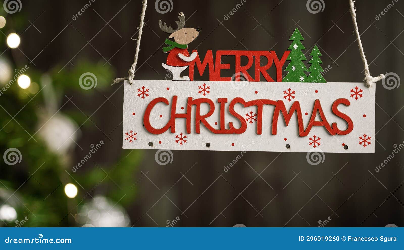 Merry Christmas Sign Hanging with Tree on the Background Stock Photo ...
