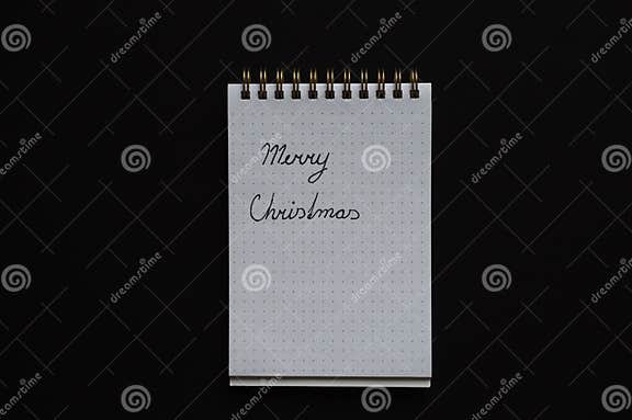 Merry Christmas Write in Notepad with Black Background Stock Photo ...