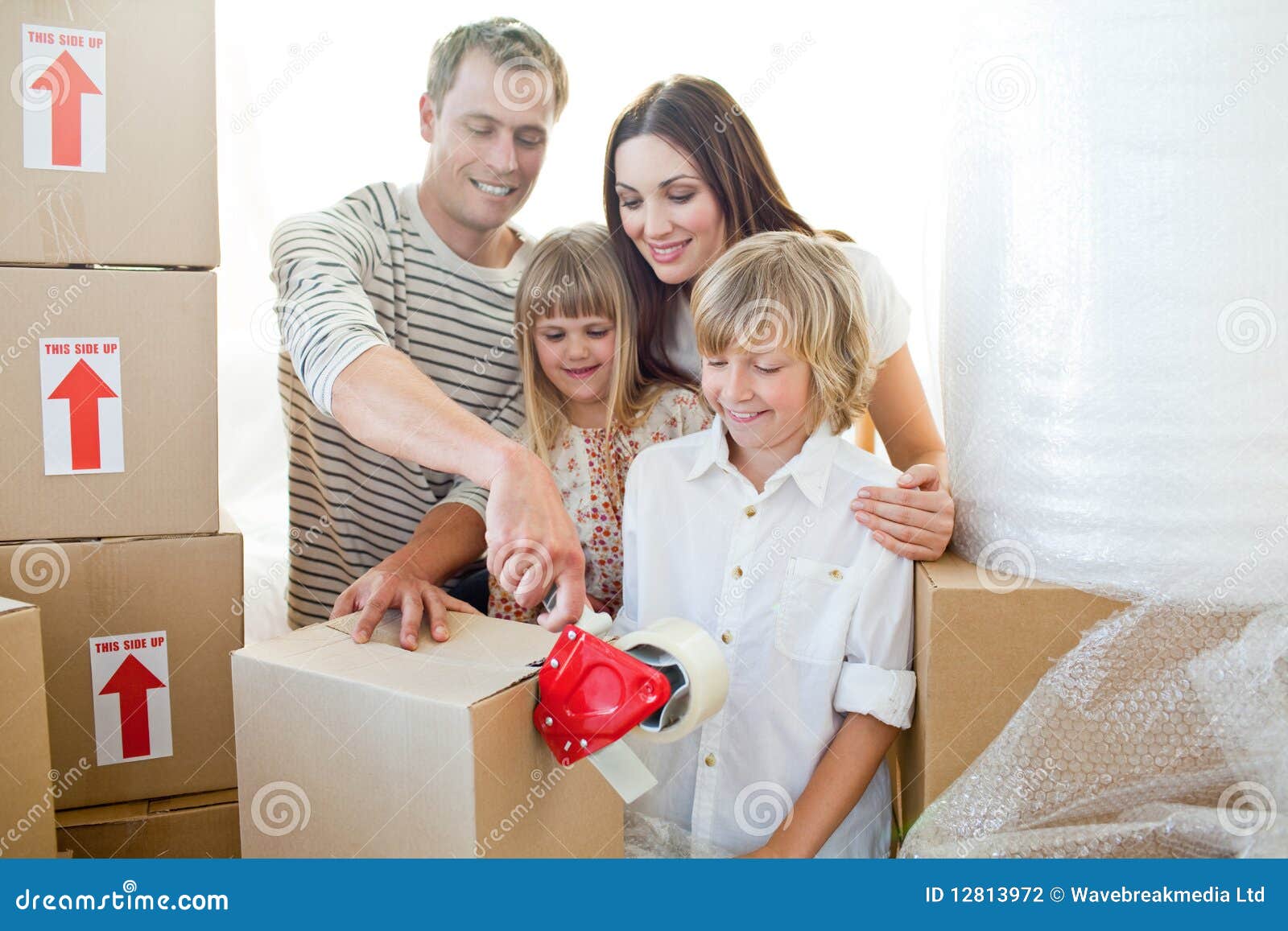 Merry family packing boxes stock photo. Image of packing - 12813972