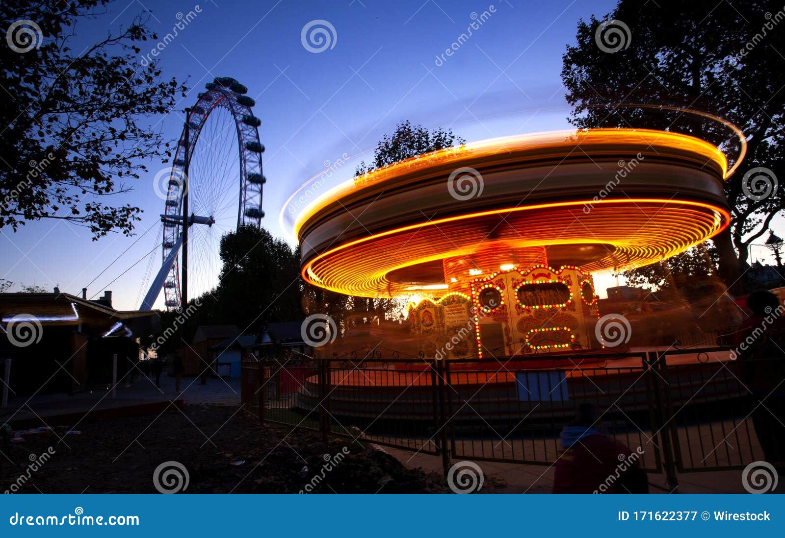 Merry Go Round and London Eye Editorial Photography - Image of carousel ...