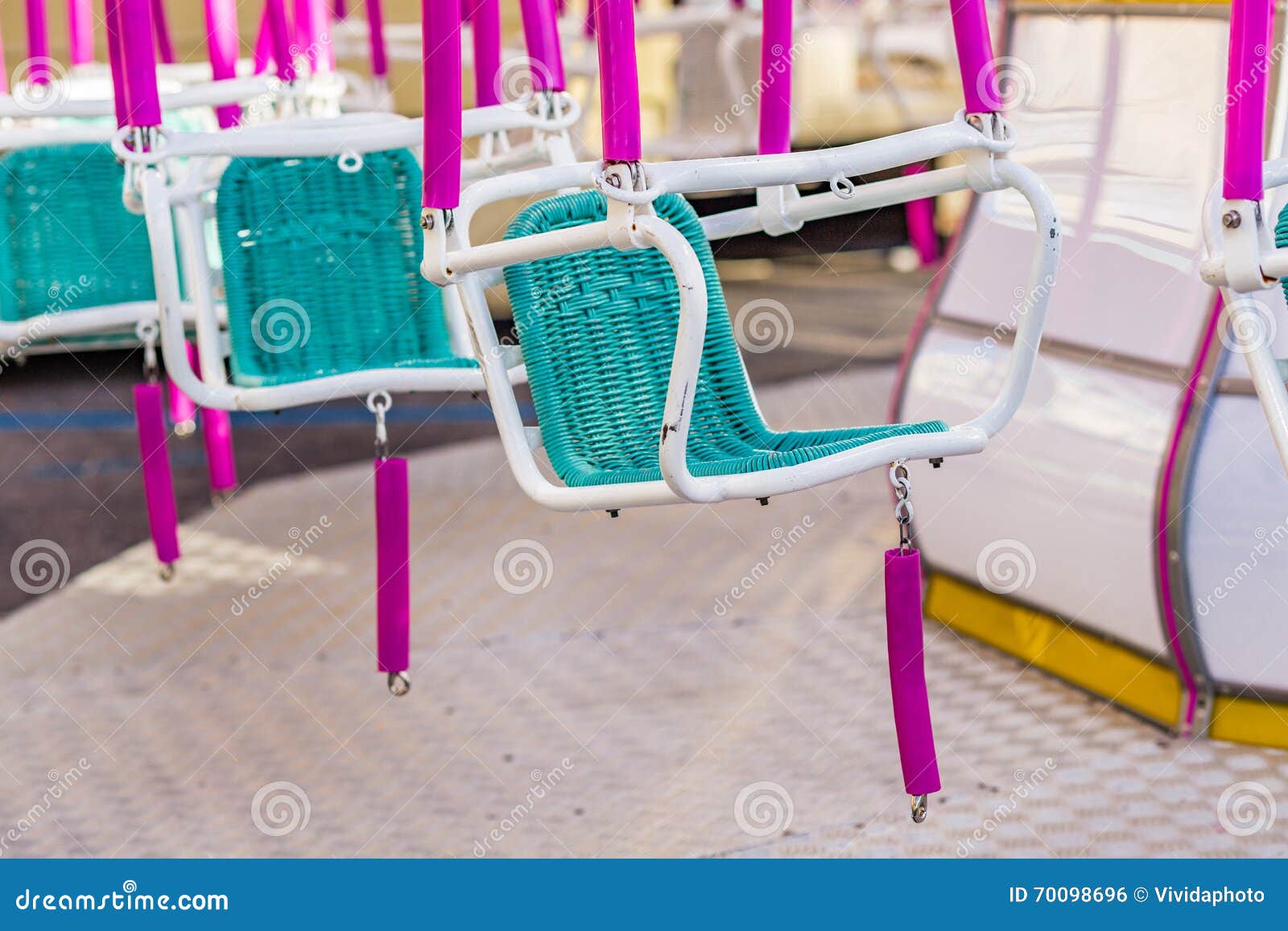 Merry-go-round seats stock photo. Image of attraction - 70098696