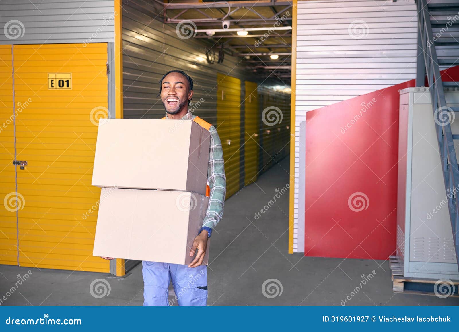 Cheerful Freight Handler Posing for Camera at Work in Warehouse Stock ...