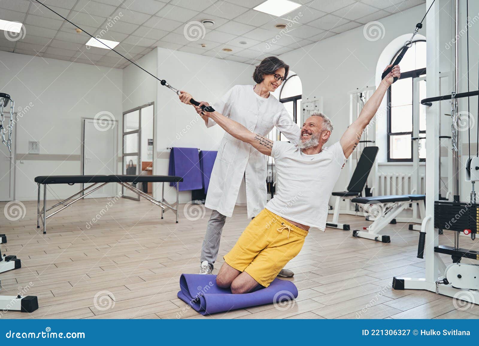 Athlete Undergoing the Physiotherapy Session with a Physiotherapist ...