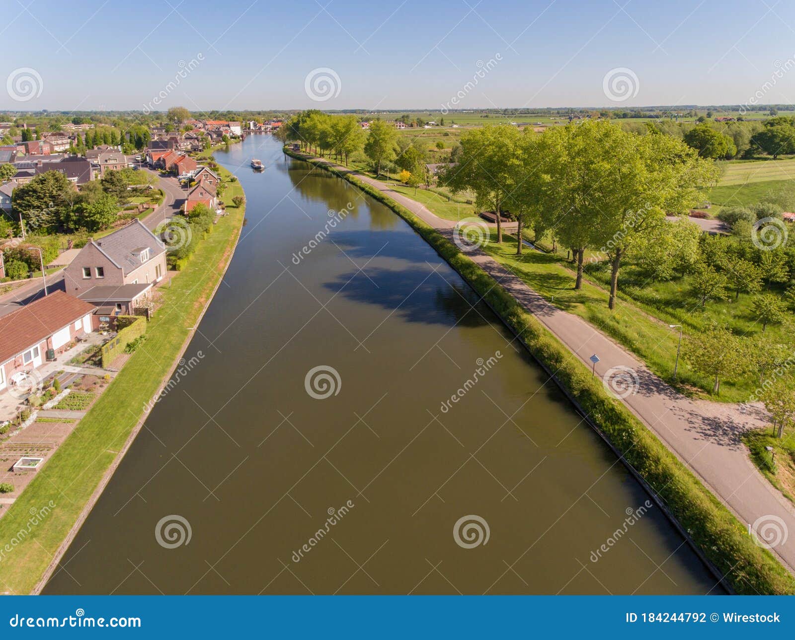 Merwede Canal Surrounded by the Trees and Buildings of the Village ...