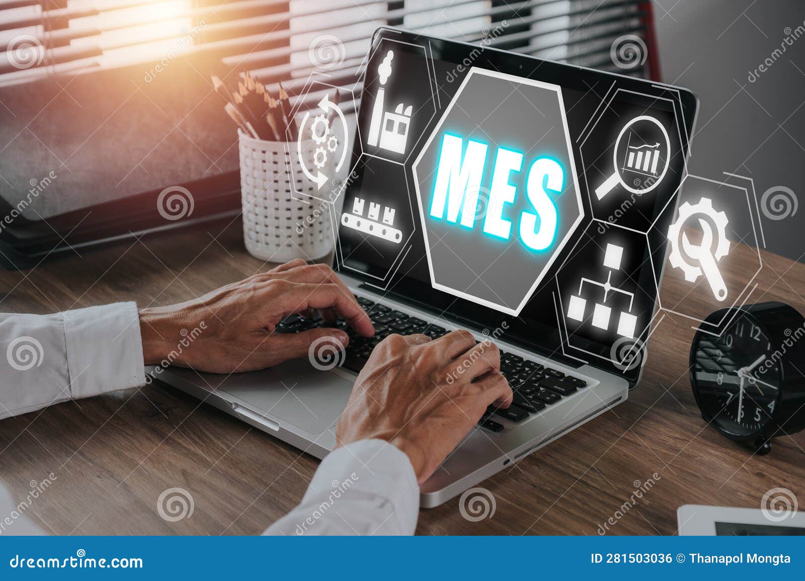 Businessman Working on Laptop with Manufacturing Execution System Icon on Virtual Screen Stock ...