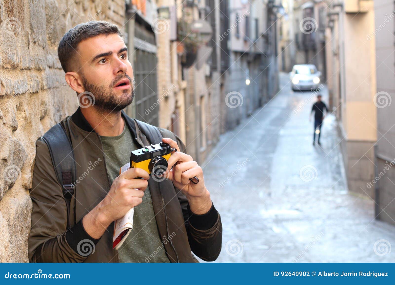 Mesmerized Man Holding a Vintage Camera during Trip Looking a Something ...
