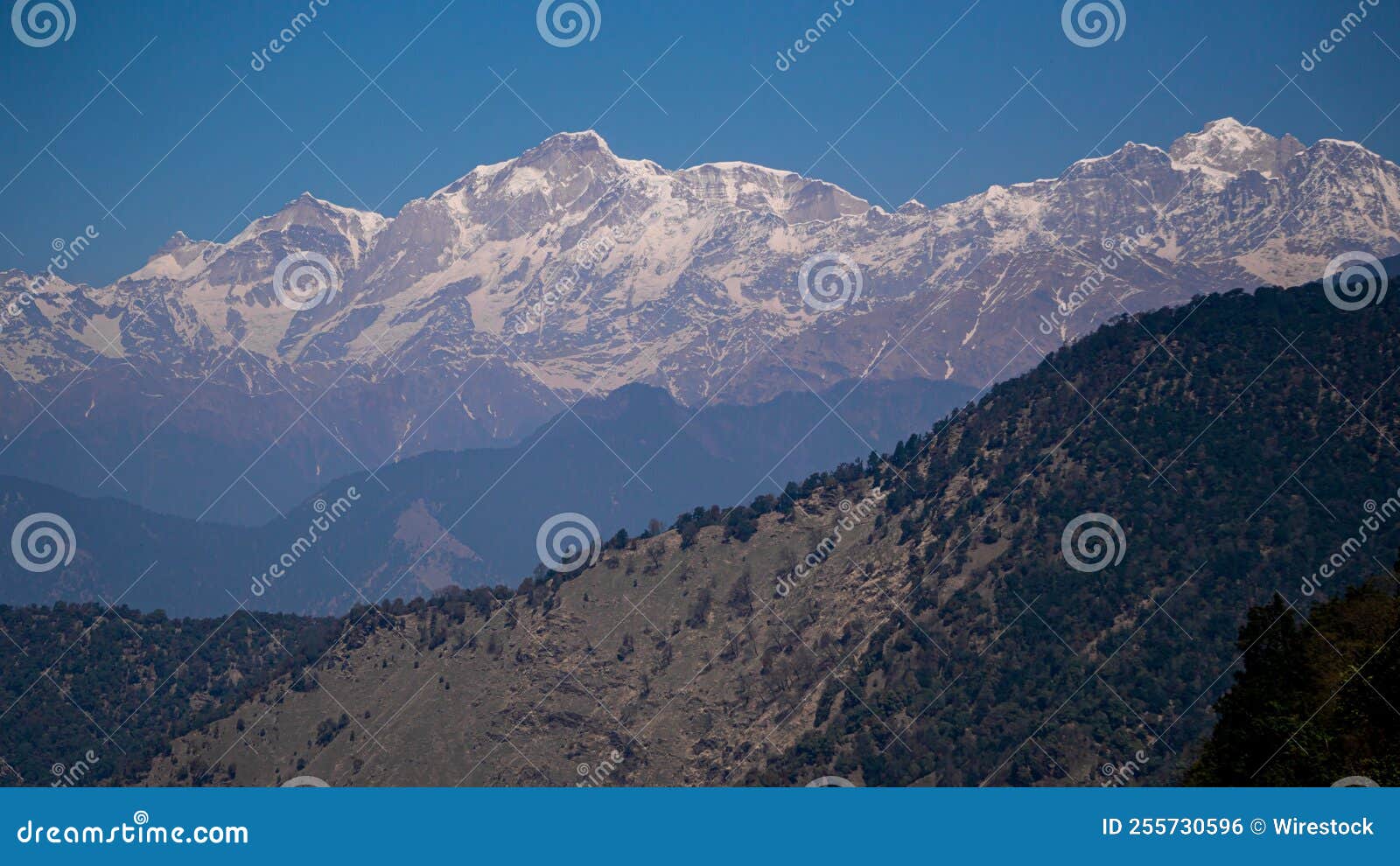 Mesmerizing Landscape with High Mountain Range and Forest-covered Hills ...