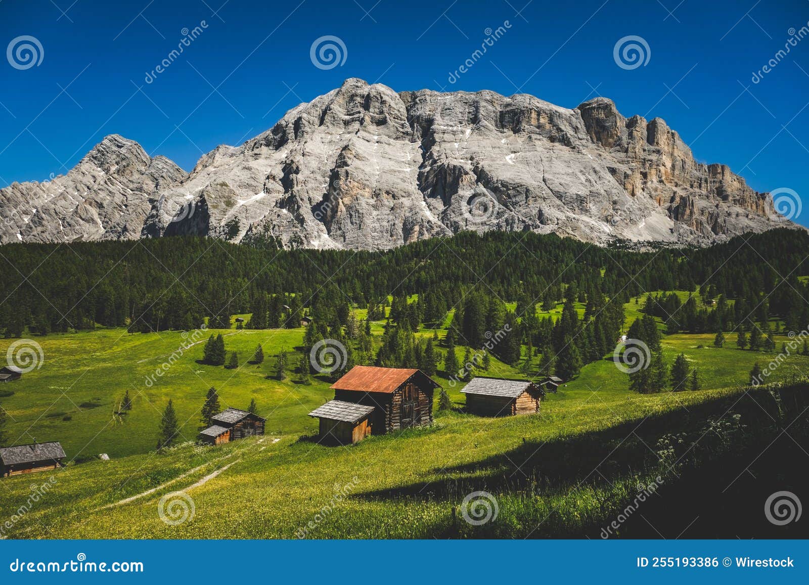 Mesmerizing Scenery of the Dolomites Overlooking Meadows with Huts ...