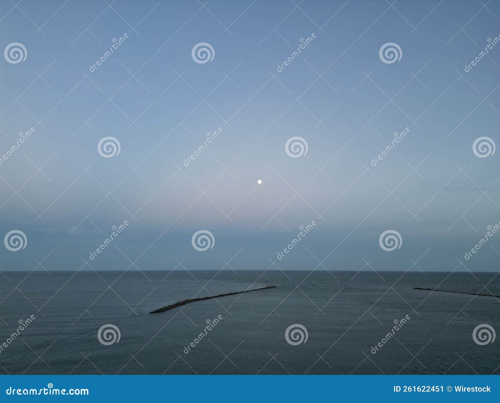 Mesmerizing Shot of a Seascape Under the Full Moon in the Evening Stock ...