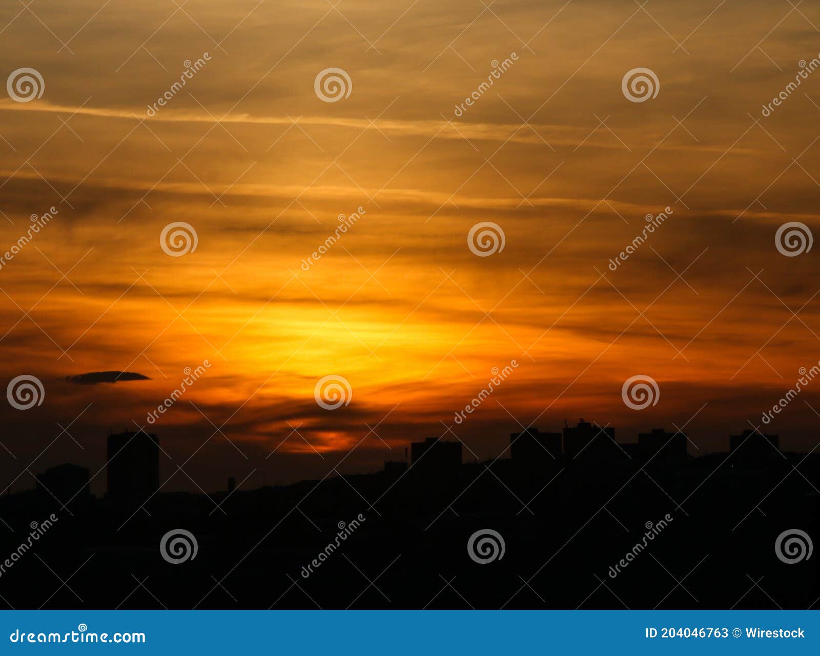 Mesmerizing Sunset Sky Over the Silhouettes of Buildings Stock Image ...