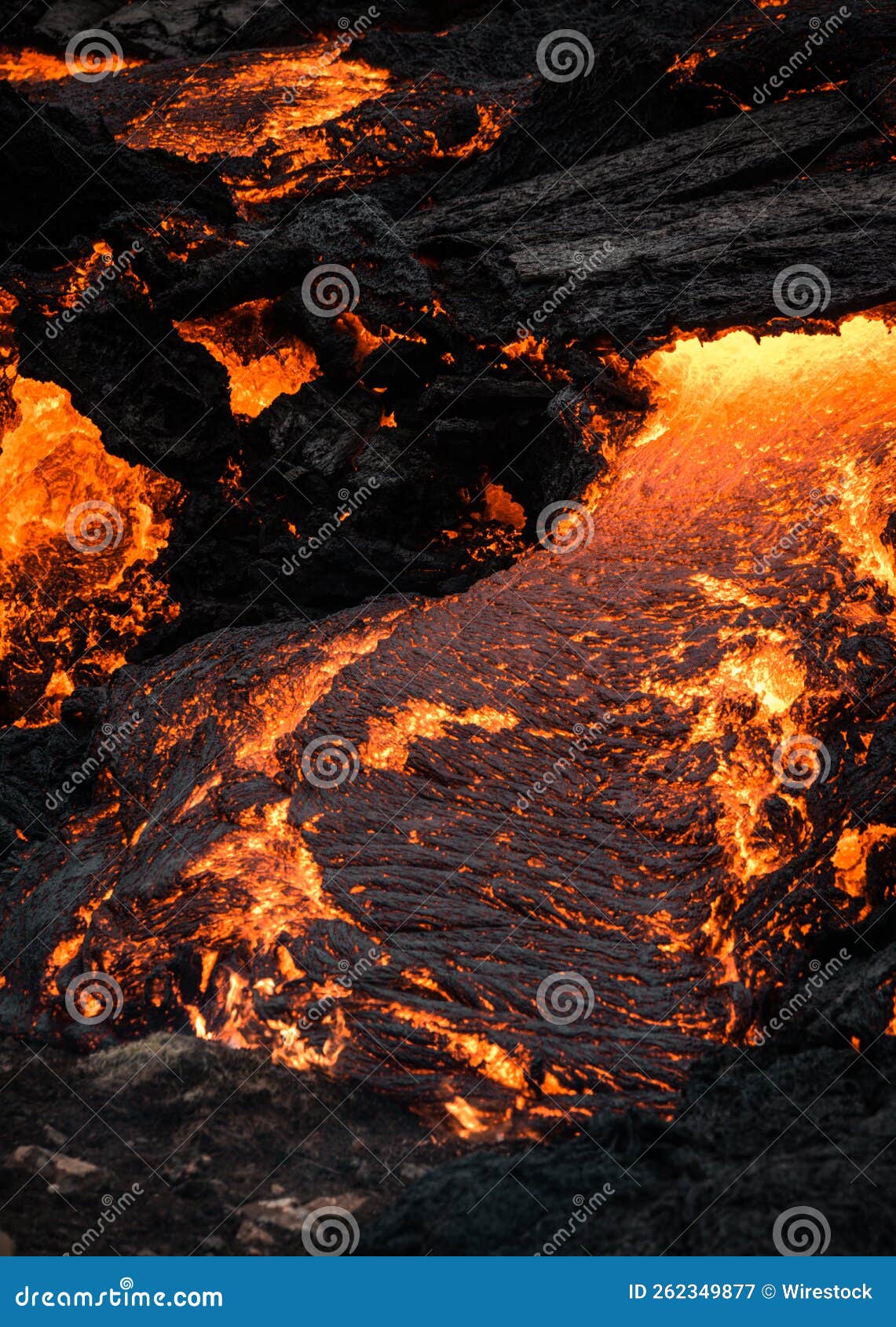 Mesmerizing Vertical Shot of Lava Flowing Over the Bumpy Mountain Stock ...