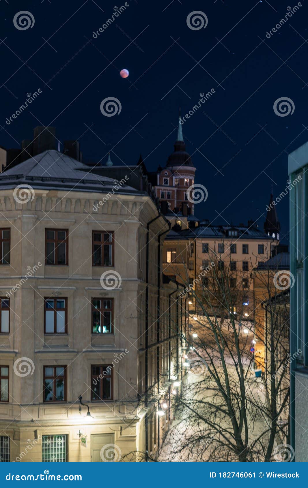 Mesmerizing View of the Buildings and the Full Moon at Night Stock ...